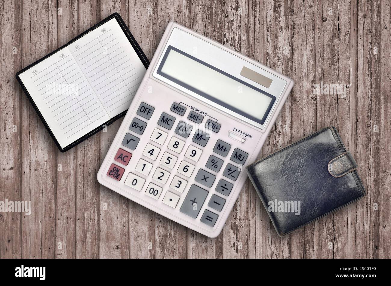 Office flat lay composition with big calculator, address book and black ...