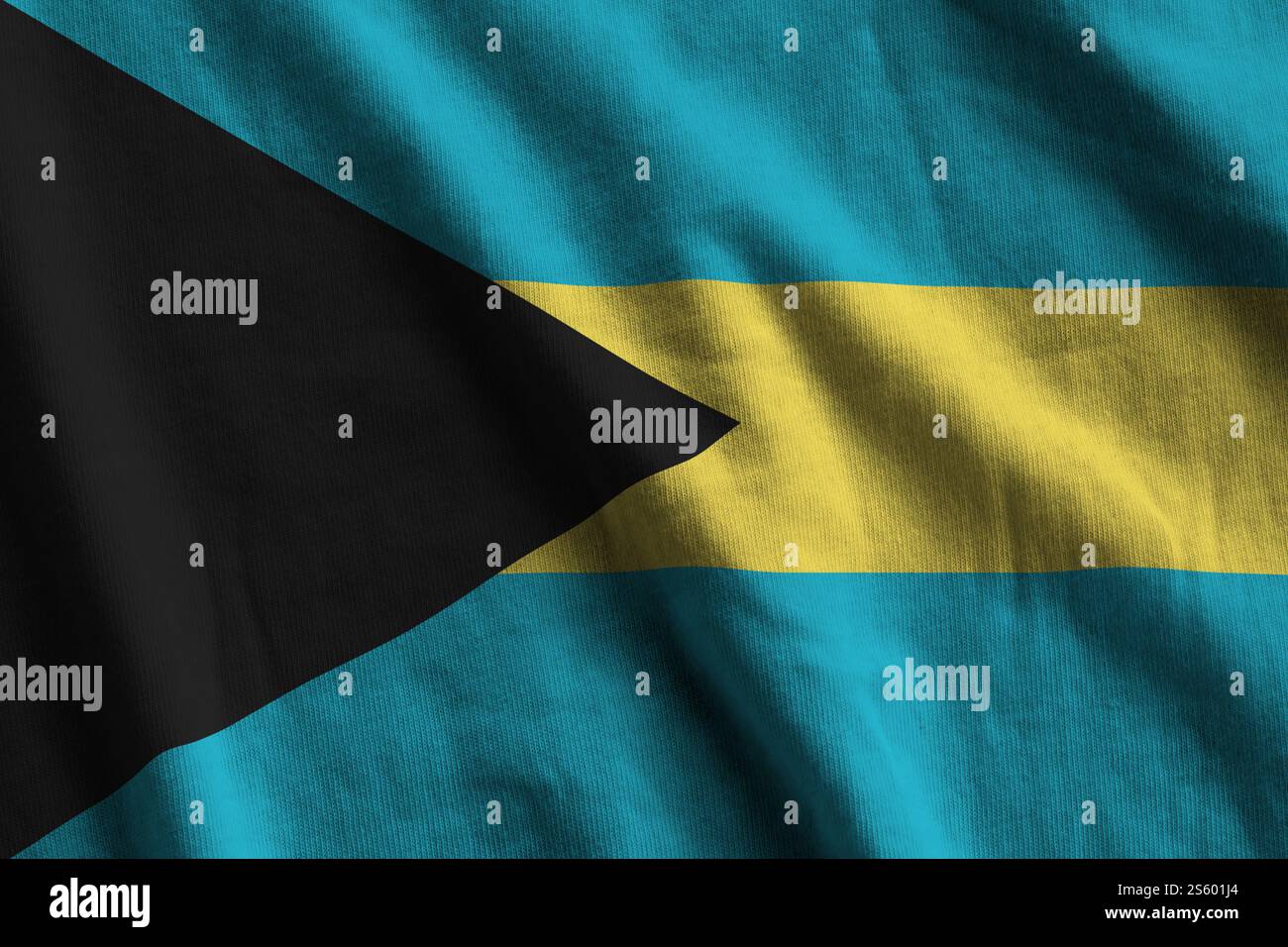 Bahamas flag with big folds waving close up under the studio light ...