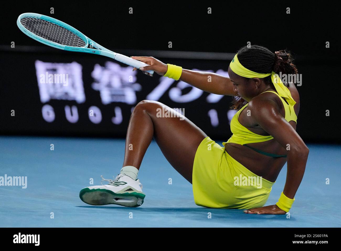 Coco Gauff of the U.S. gets back to her feet after a fall during her ...