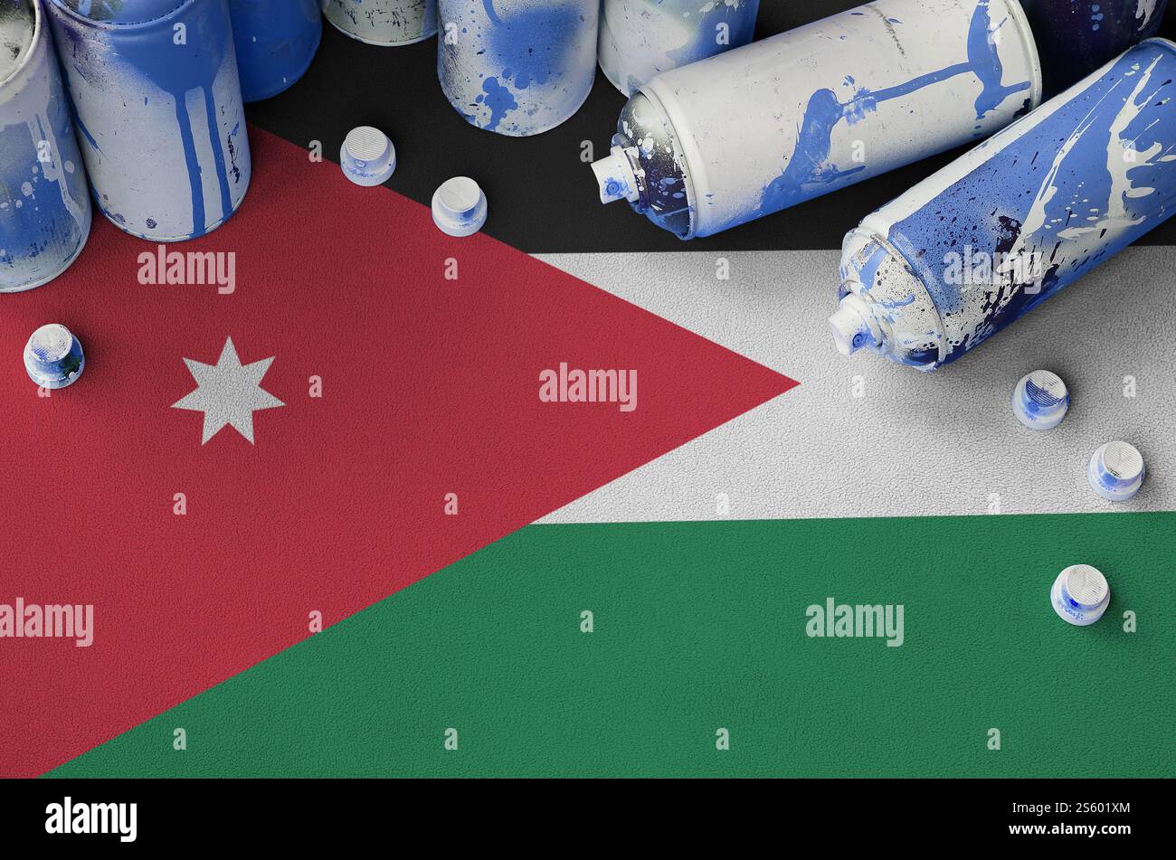 Jordan flag and few used aerosol spray cans for graffiti painting ...