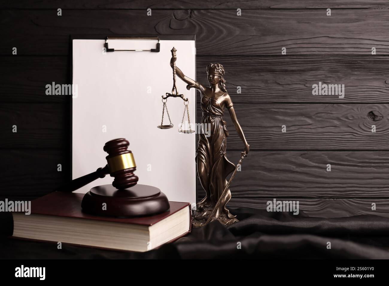Lady justice or justitia the Roman goddess of Justice. Statue on brown ...