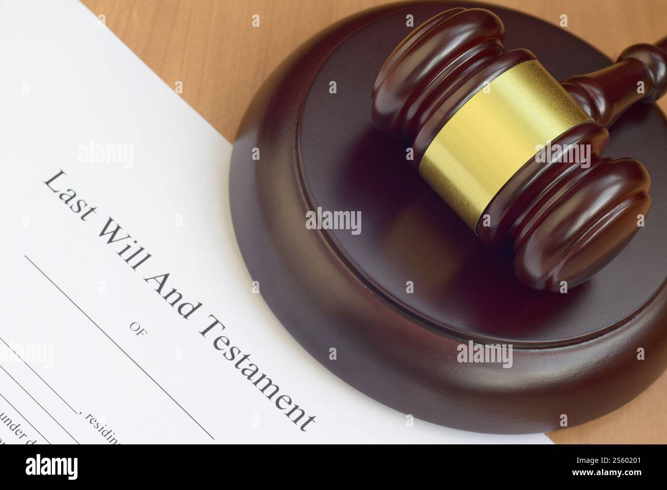 Justice mallet and Last Will and Testament blank document on wooden ...
