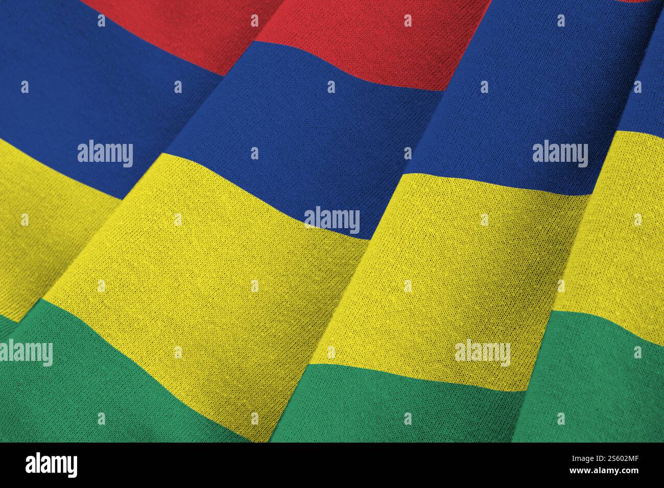 Mauritius flag with big folds waving close up under the studio light ...