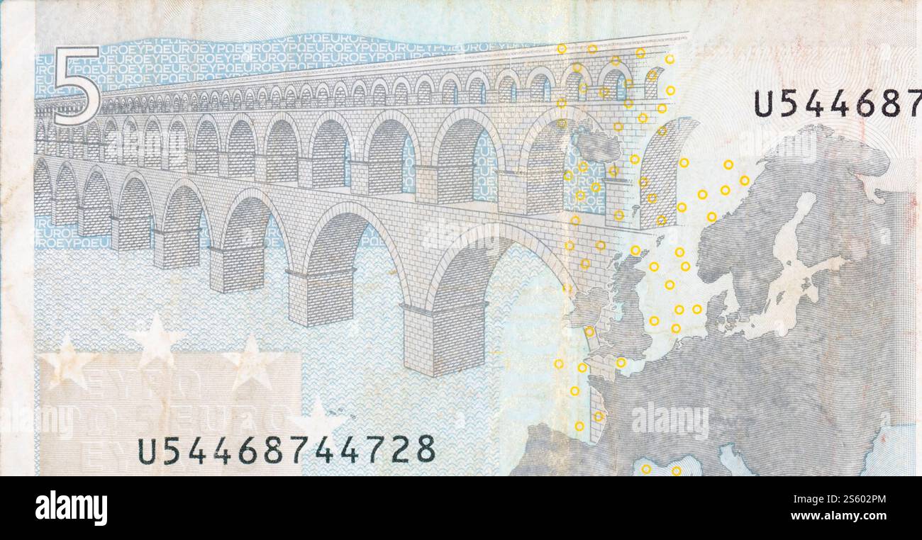 Fragment part of 5 euro banknote close-up with small brown details ...