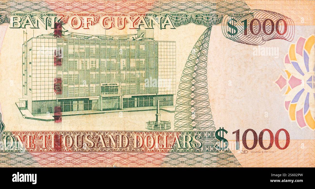 Part of brown Guyana 1000 dollars Banknote fragment close up. Part of brown Guyana 1000 dollars ...
