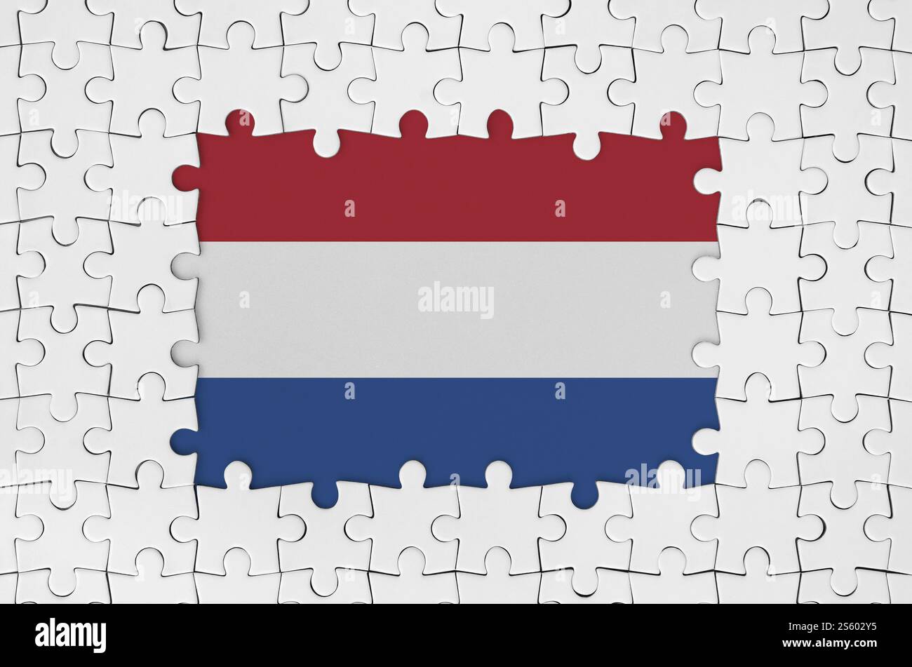 Netherlands flag in frame of white puzzle pieces with missing central ...