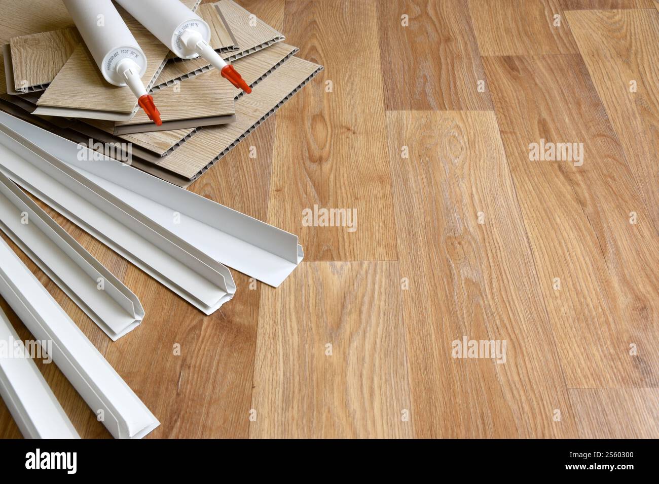 Set of items for PVC ceiling indoor works. Assembly adhesive bottles ...