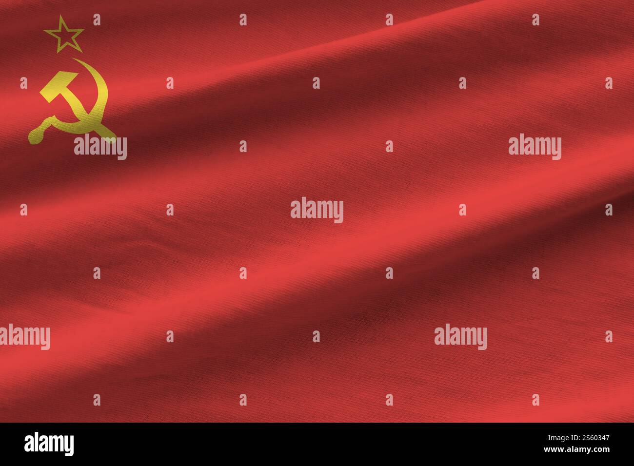 Soviet Union flag with big folds waving close up under the studio light indoors. The official ...