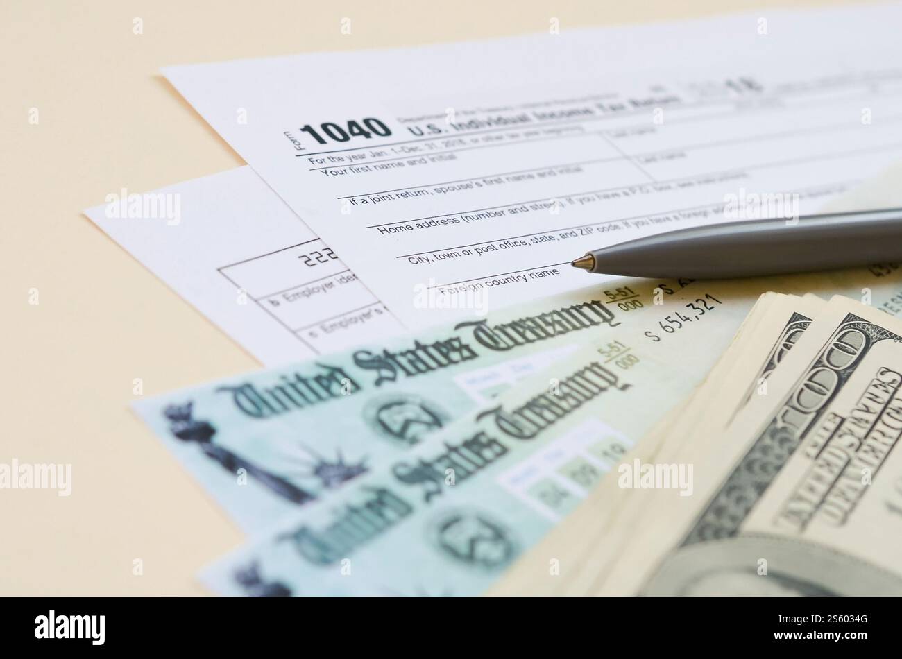 1040 Individual Income tax return form with Refund Check and hundred ...