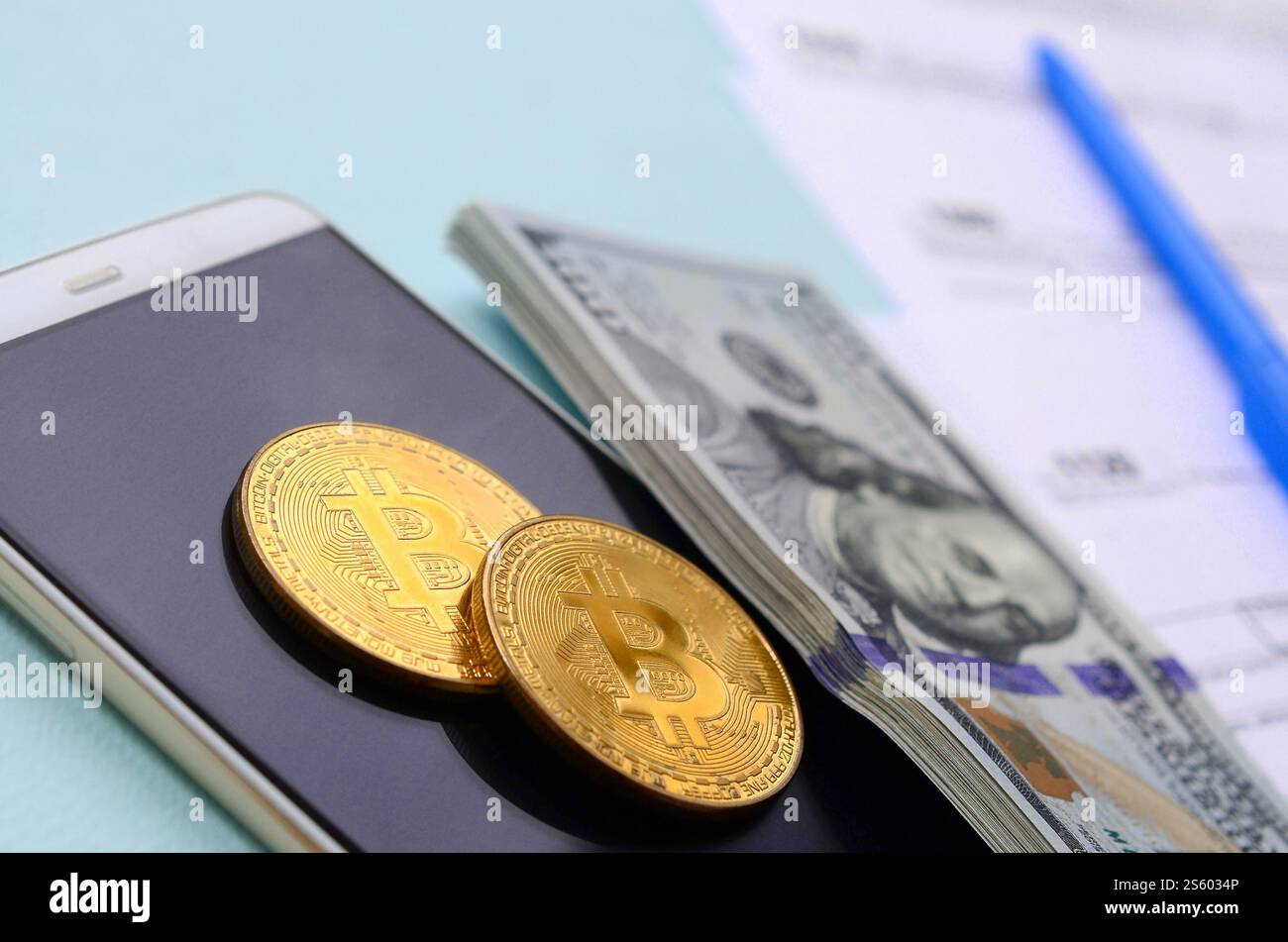Bitcoins lies with the tax forms, hundred dollar bills and smartphone ...