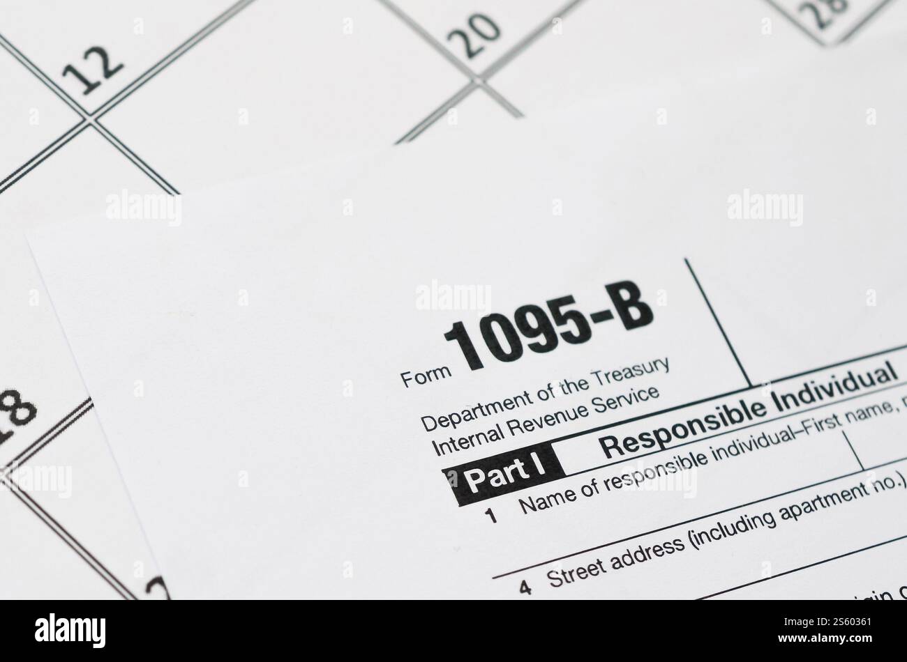 IRS Form 1095-B Health Coverage tax blank lies on empty calendar page ...