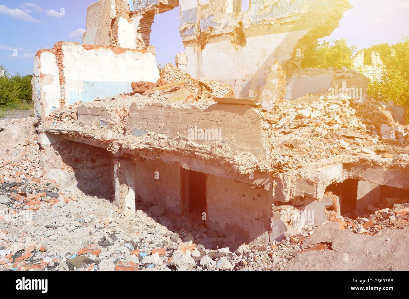 Collapsed industrial multistorey building in daytime. Disaster scene ...