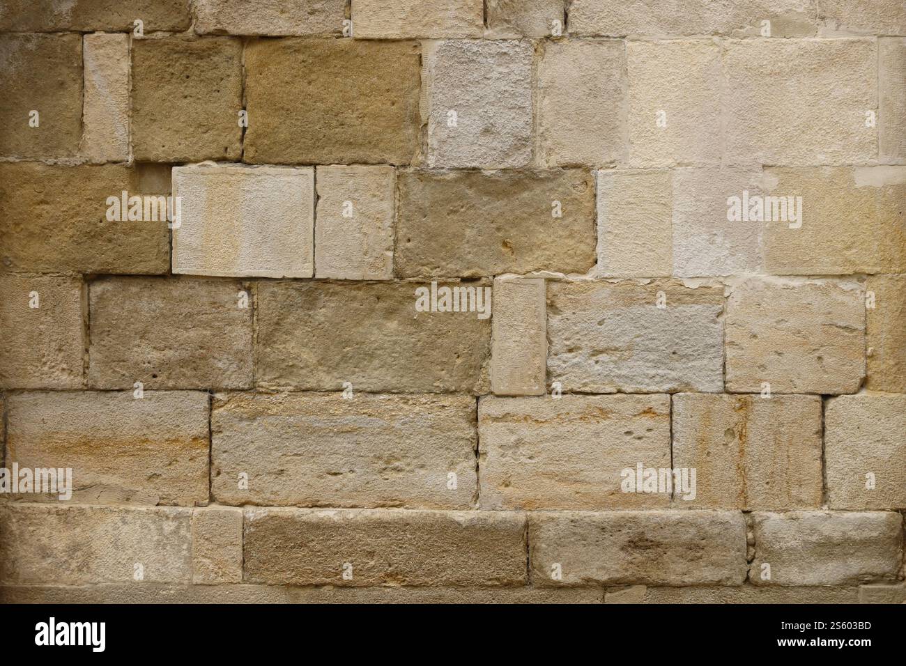 Texture of a stone wall with many big brown and grey stones armed with ...