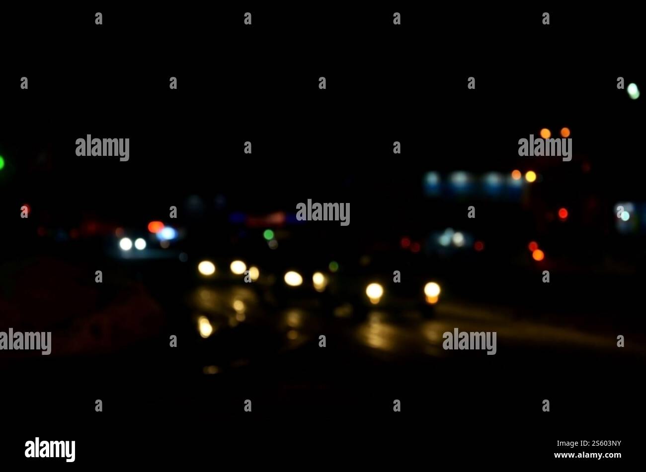 Blurred Defocused Lights of Traffic on a Wet Rainy City Road at Night ...