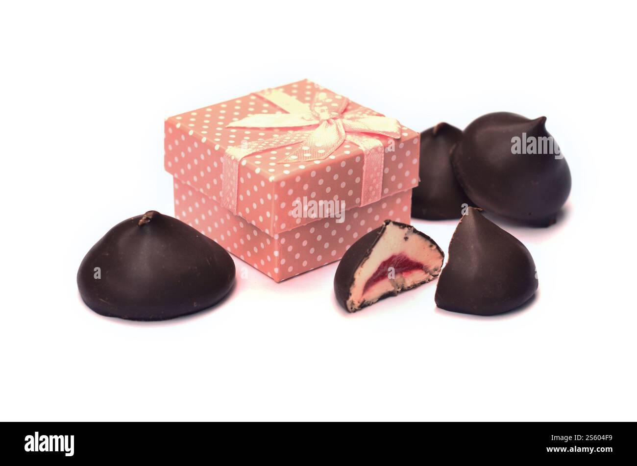 Pink dotted mini present-box with ribbon and chocolate cherry candies ...