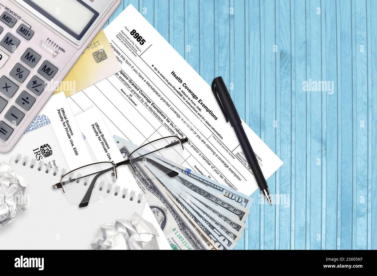 IRS form 8965 Health Coverage Exemptions lies on flat lay office table ...