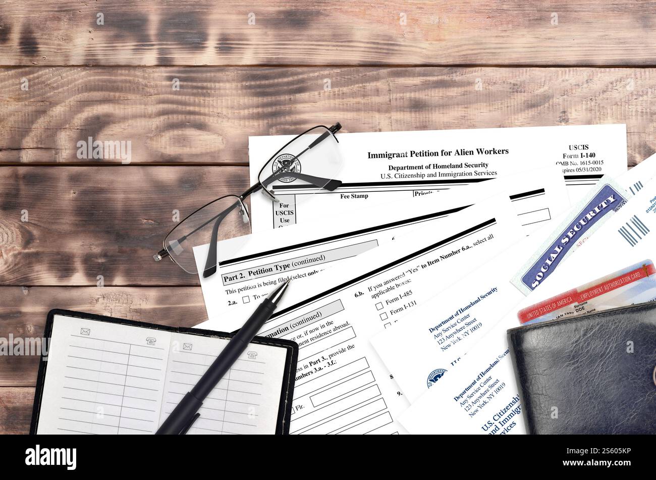 USCIS form I-140 Immigrant petition for alien workers lies on flat lay ...