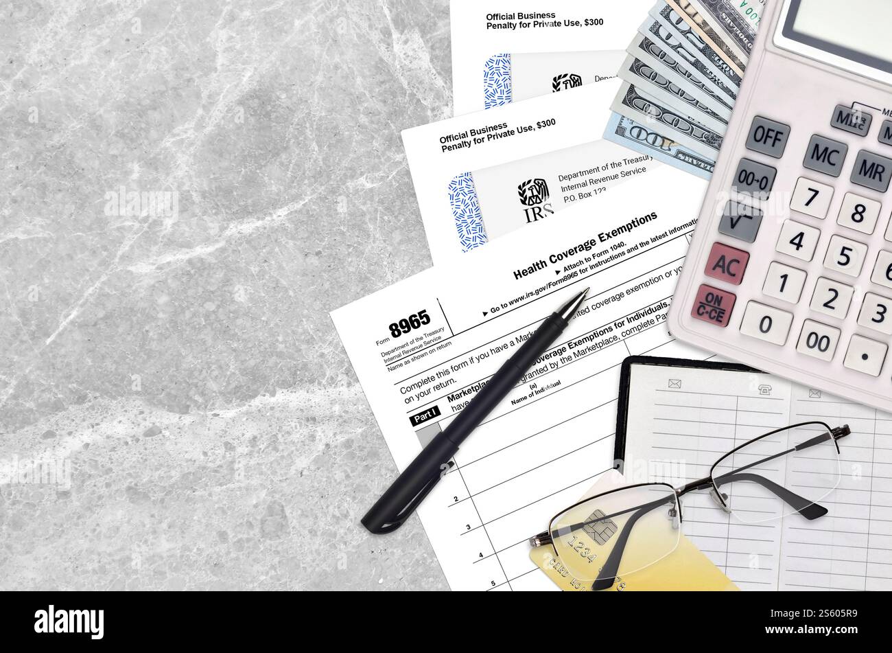 IRS form 8965 Health Coverage Exemptions lies on flat lay office table ...