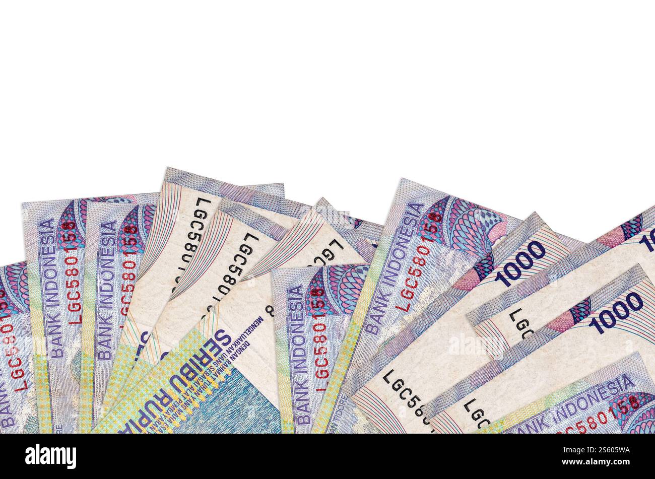 1000 Indonesian rupiah bills lies on bottom side of screen isolated on ...
