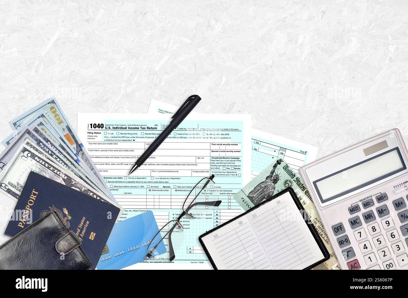 IRS form 1040 U.S. Individual income tax return with refund check lies ...