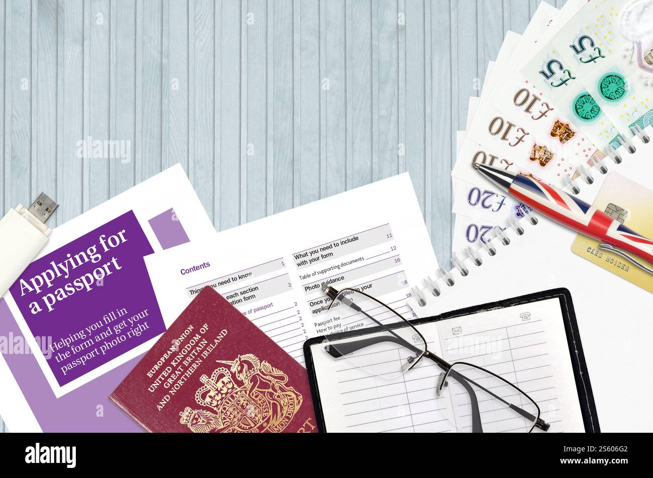 English violet guide Applying for a passport lies on table with office ...