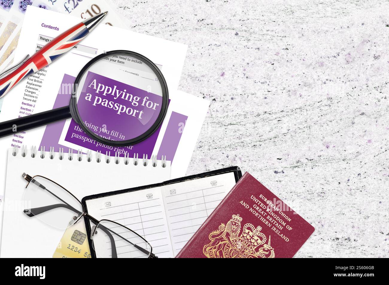 English violet guide Applying for a passport lies on table with office ...