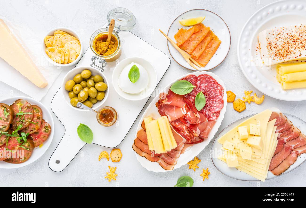 Assorted appetizers for brunch or party with salmon, cheese, salami and ...