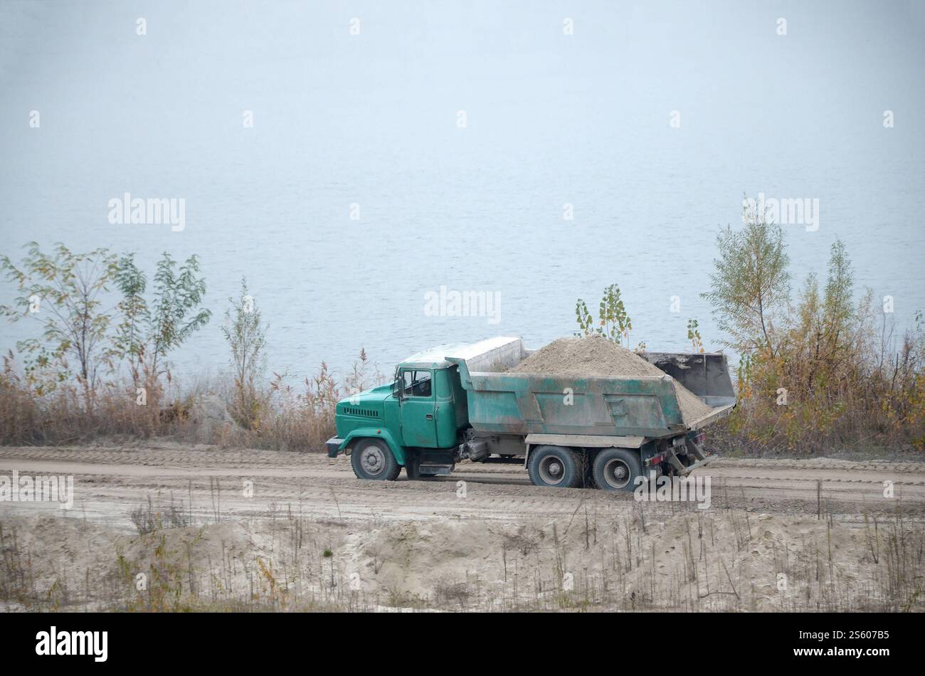 Dump truck transports sand and other minerals in the mining quarry ...