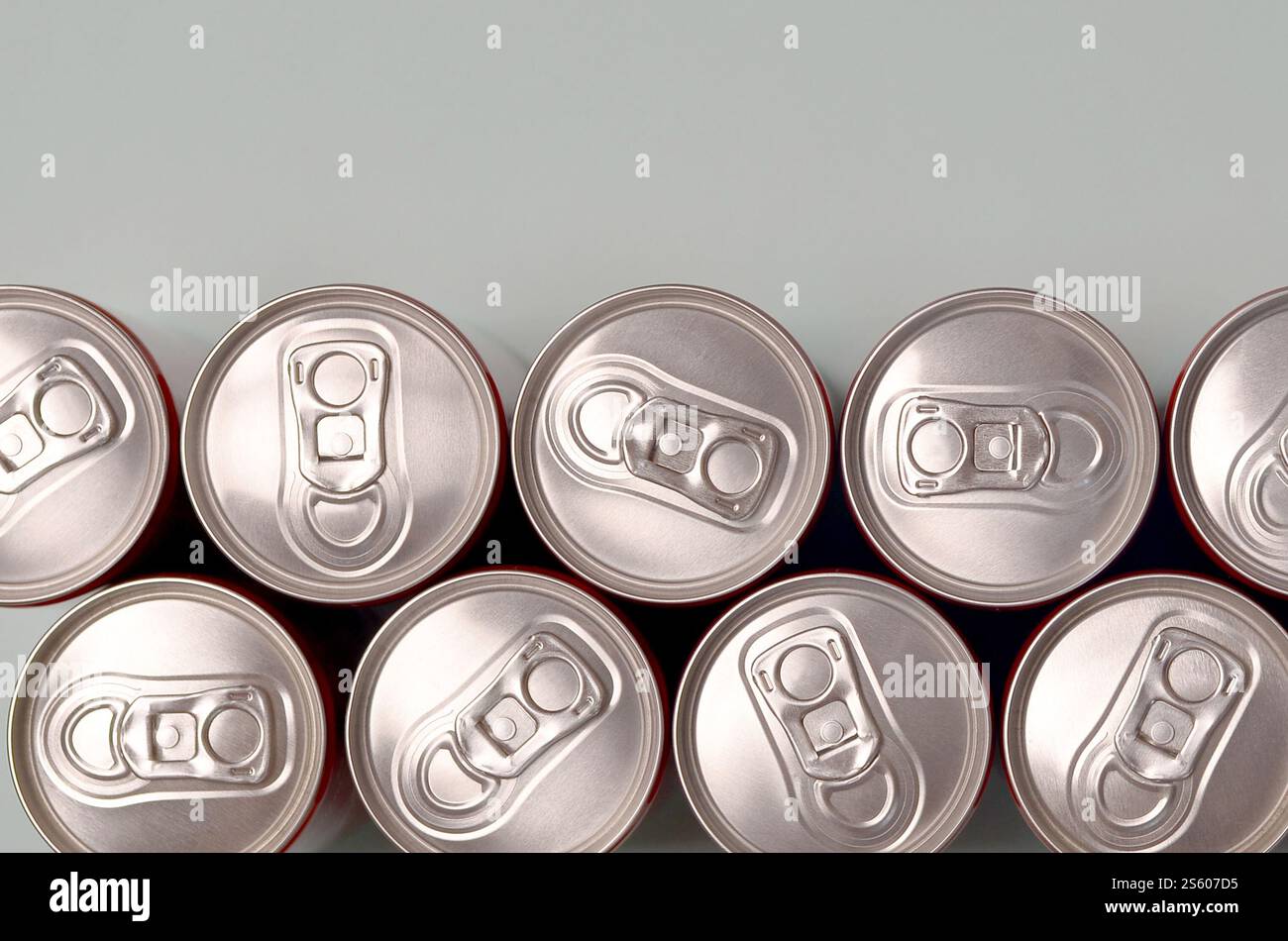 Many new aluminium cans of soda soft drink, lemonade cola, beer or ...