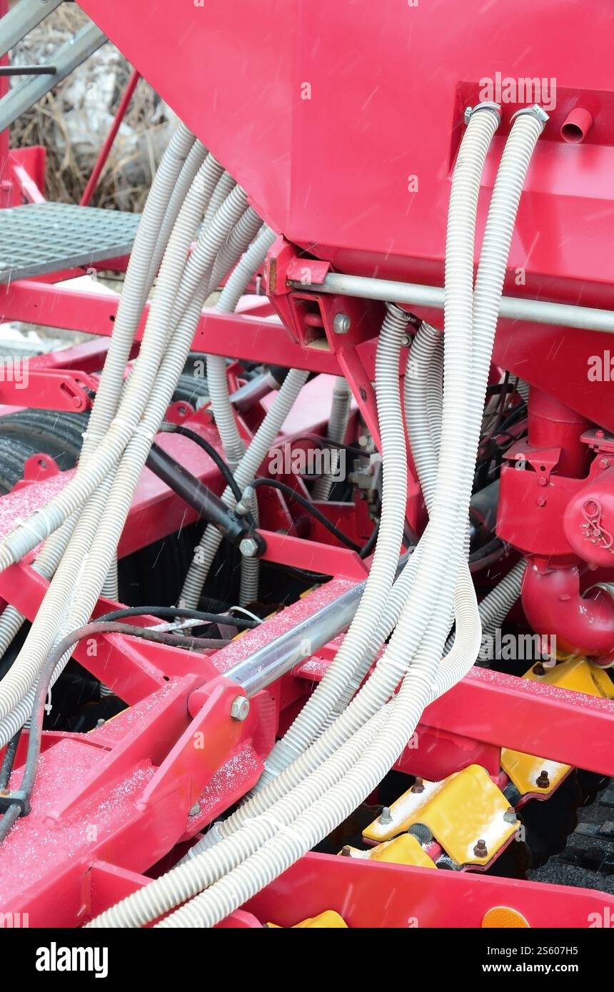 Springs and tubes are arranged in a row. A row of seeder. Heavy ...