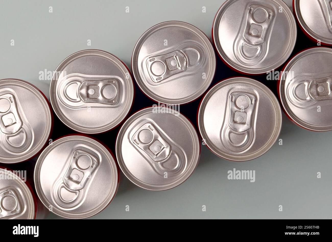 Many new aluminium cans of soda soft drink, lemonade cola, beer or ...
