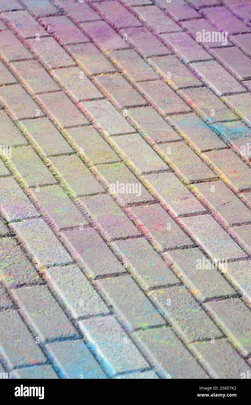 Multi colored earth, paving slabs, powder coated with dry colors at the Holi festival close up ...