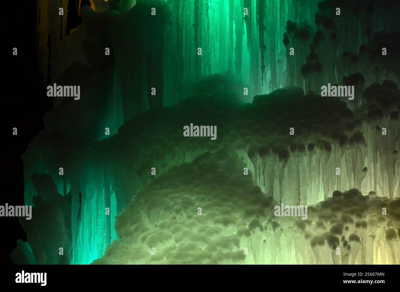 Huge ice icicles. Fragment of large blocks of ice frozen waterfall of ...