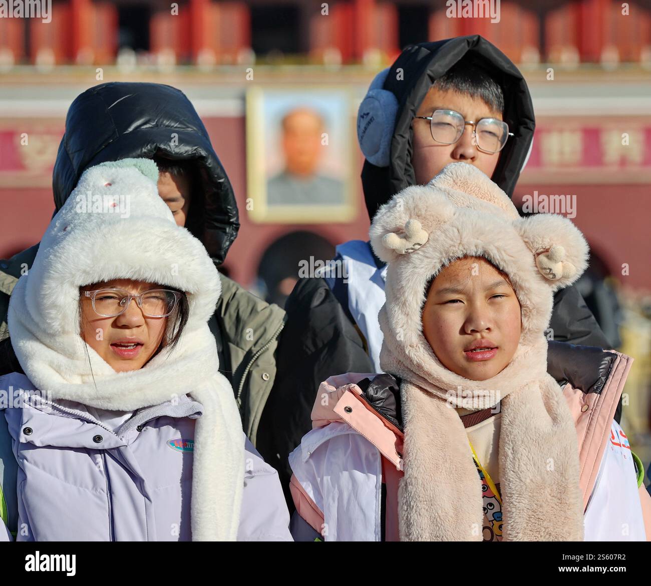 Tourists visit the Tiananmen Square amid cold air in Beijing, China, 12 ...