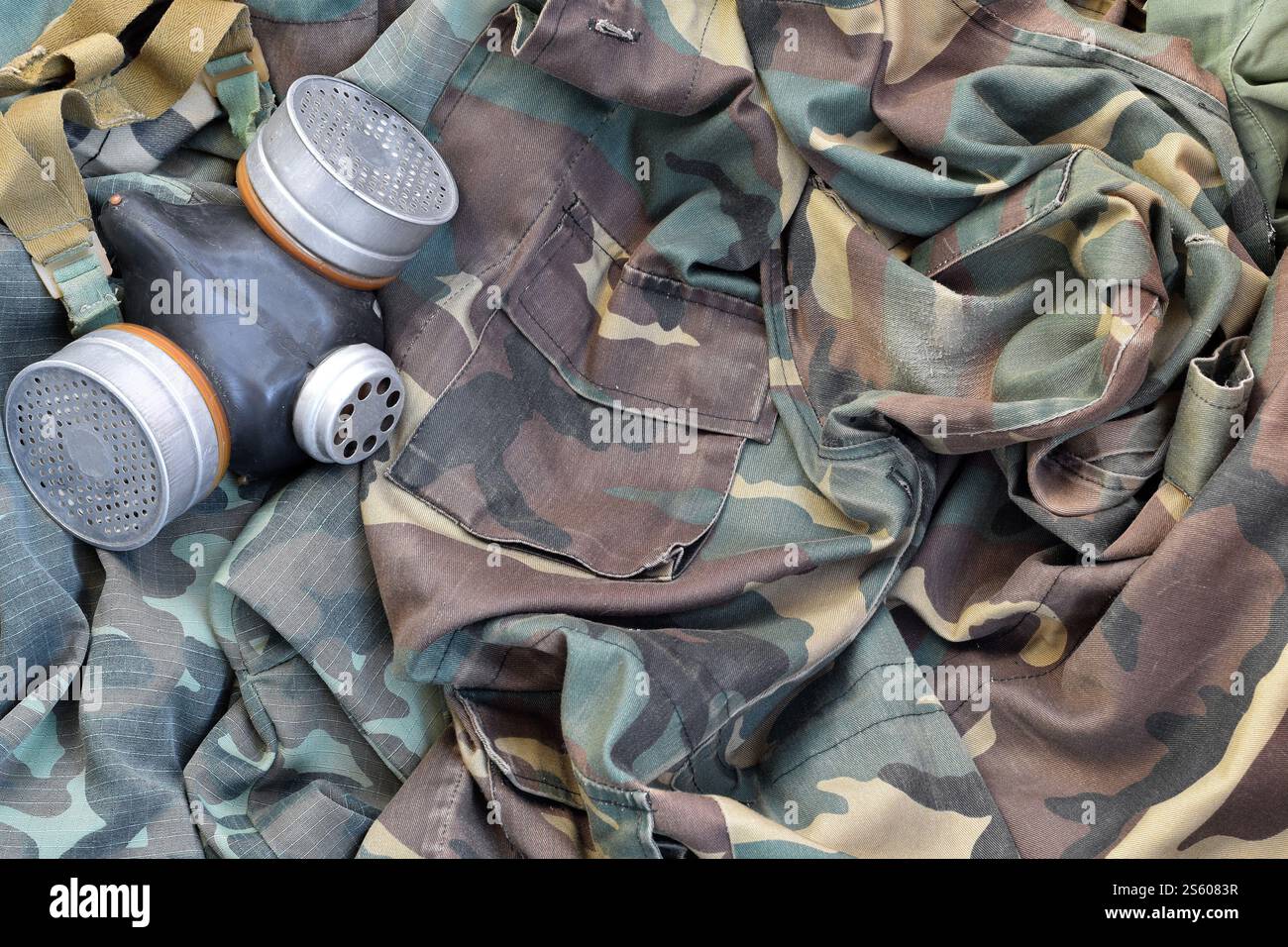 Stalker soldiers soviet gas mask lies on many green khaki camouflage ...