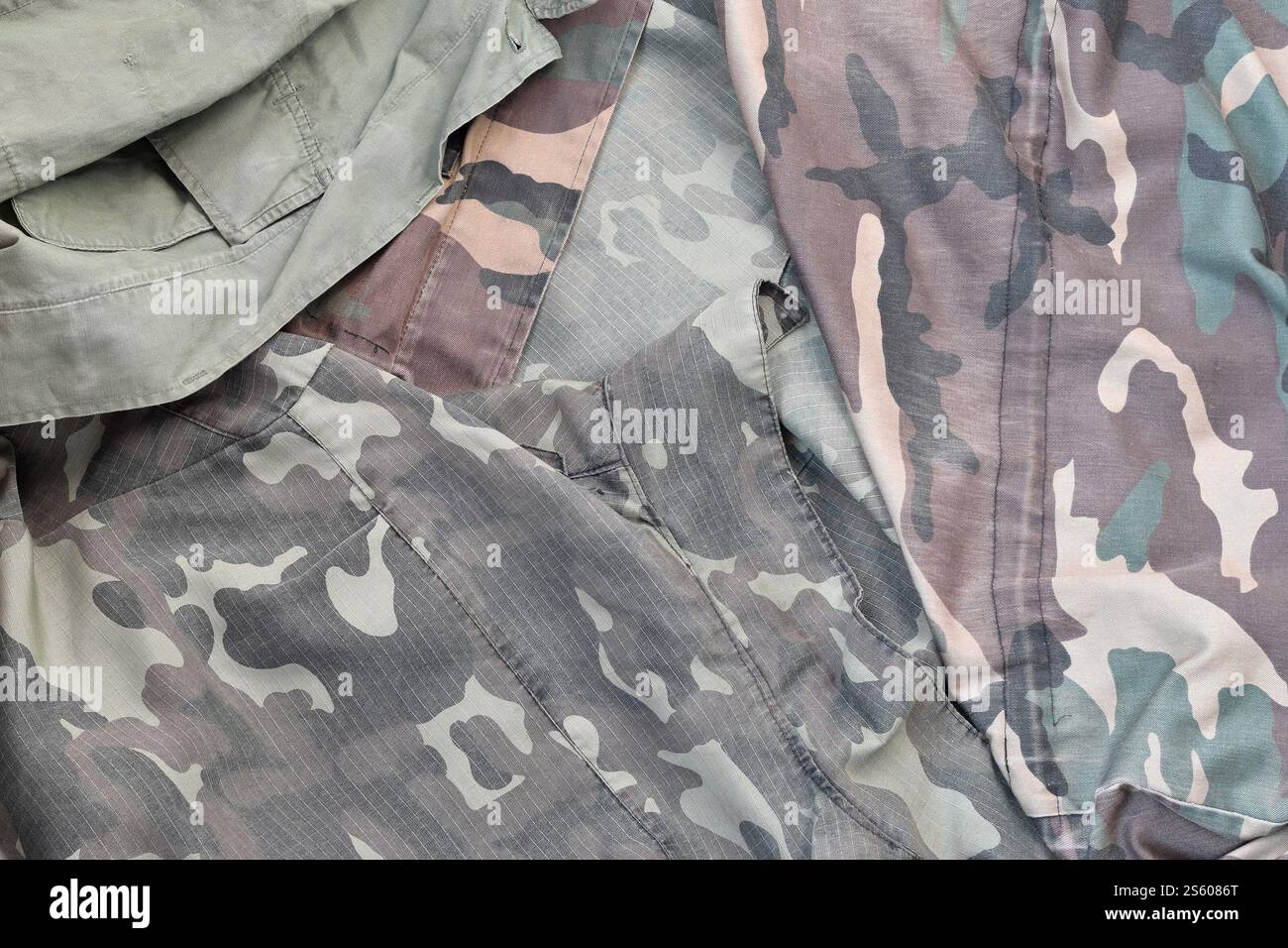 Camouflage background texture as backdrop for military service design ...
