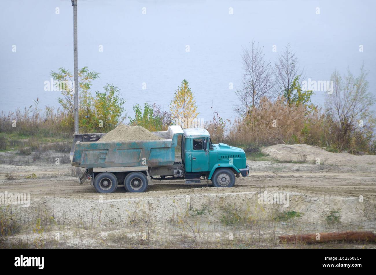 Dump truck transports sand and other minerals in the mining quarry ...