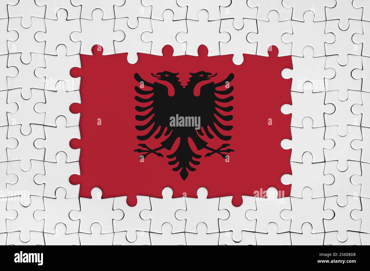 Albania flag in frame of white puzzle pieces with missing central parts ...