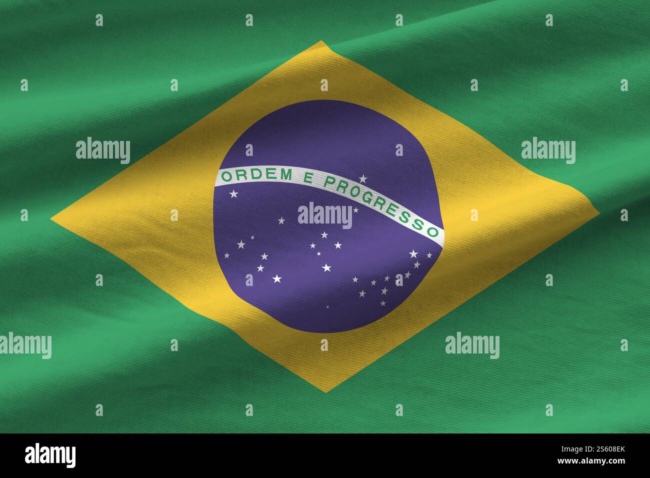Brazil flag with big folds waving close up under the studio light ...