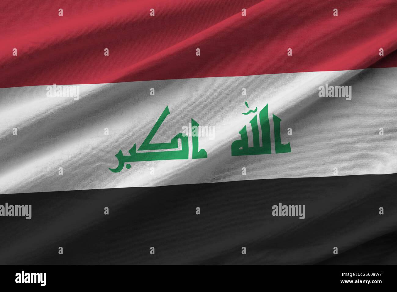 Iraq flag with big folds waving close up under the studio light indoors ...