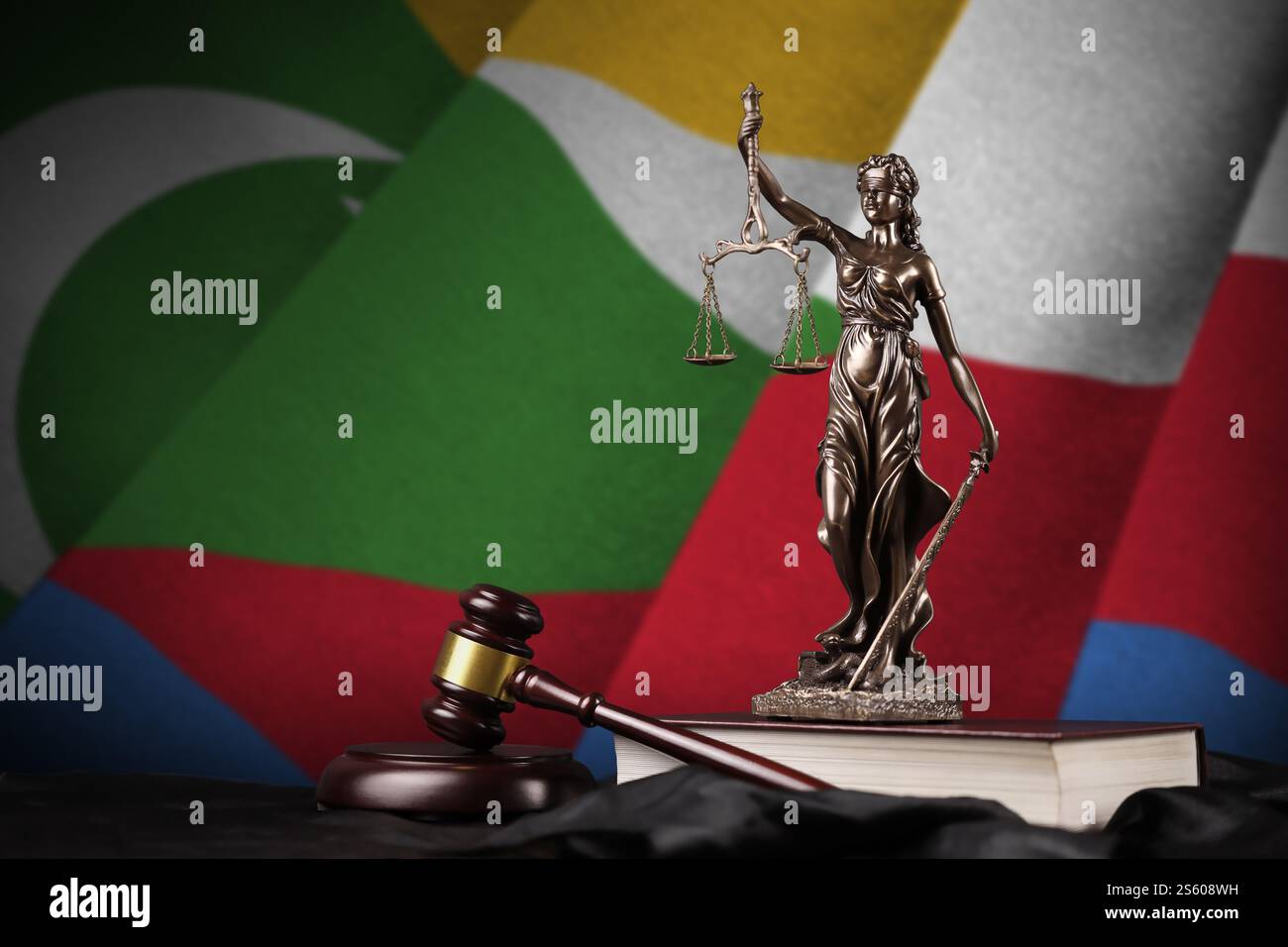 Comoros flag with statue of lady justice, constitution and judge hammer ...