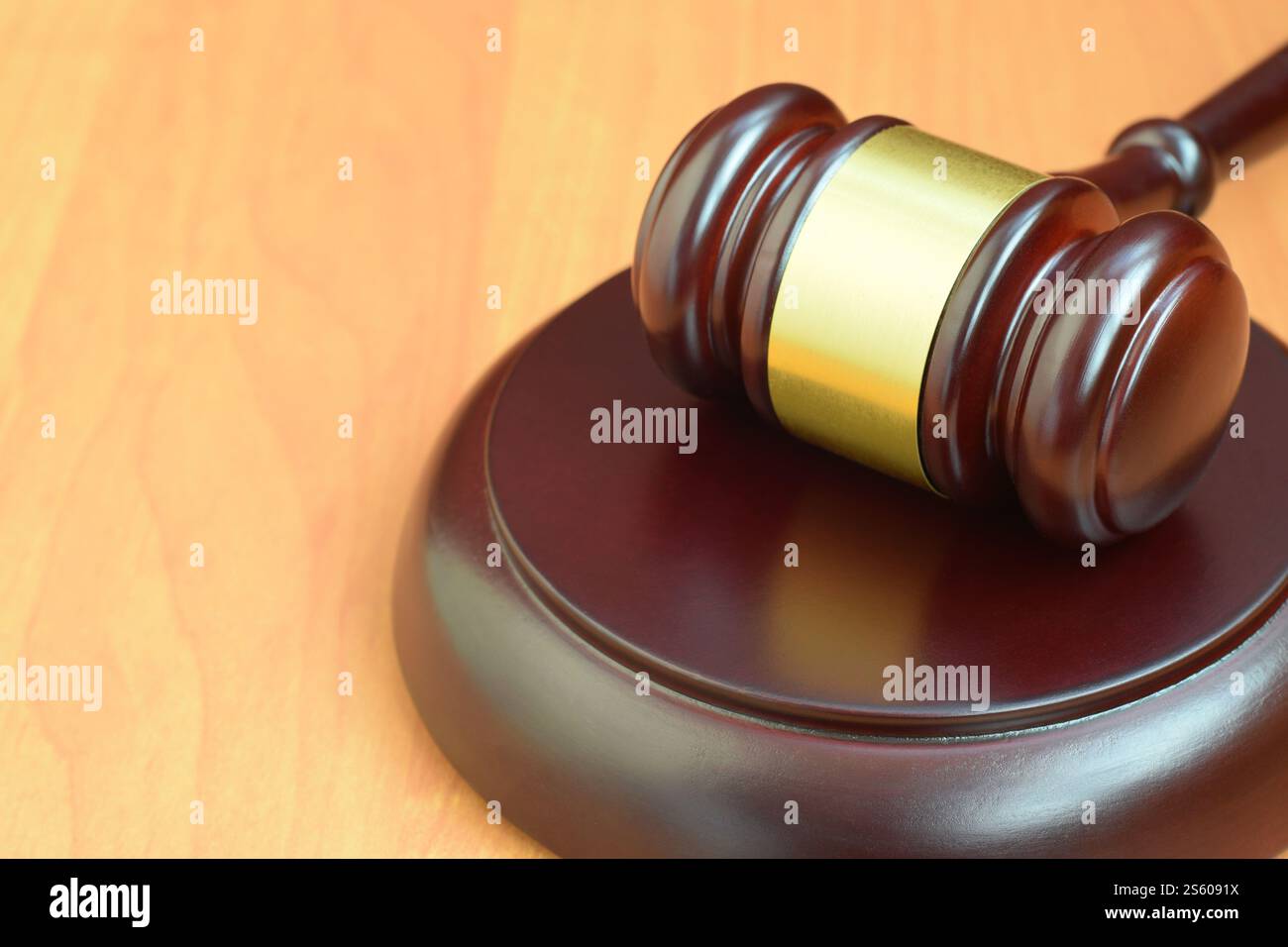 Justice mallet on wooden desk in a courtroom during a judicial trial. Law concept and empty copy ...