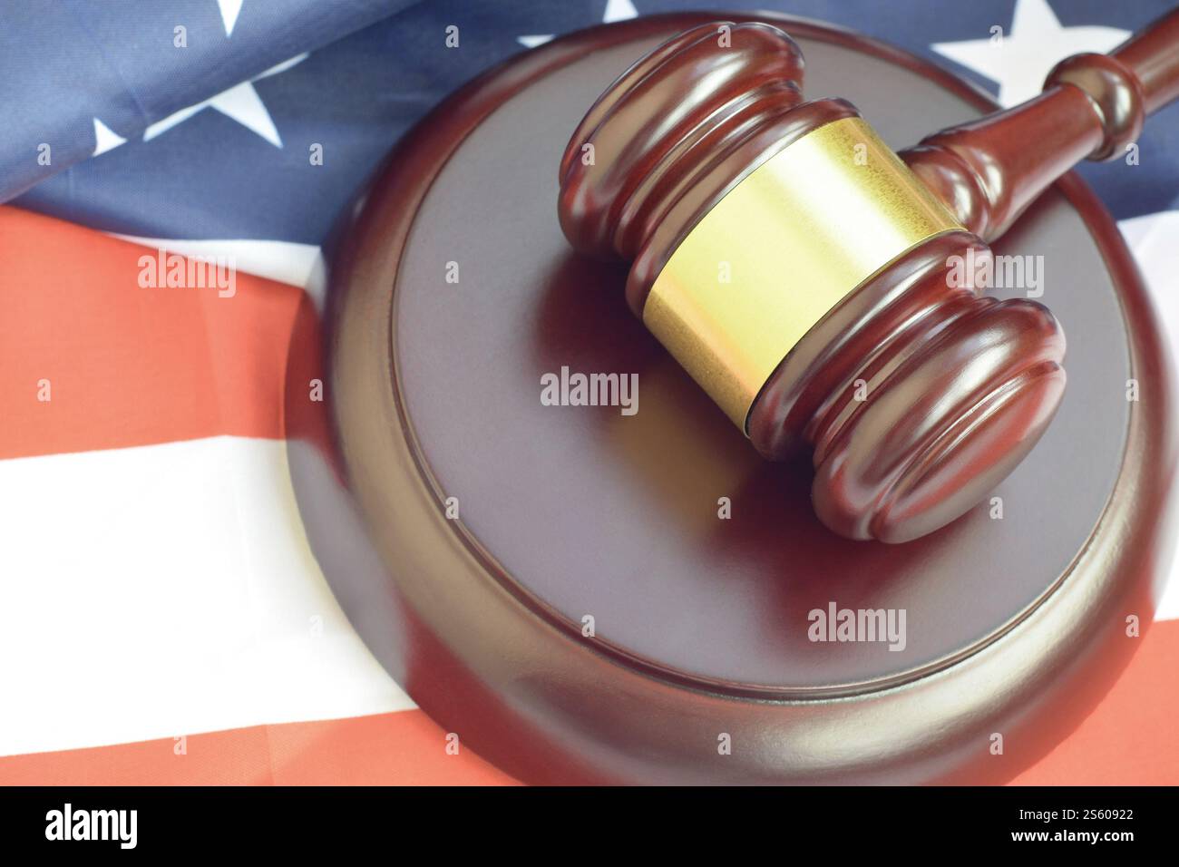 Justice mallet on United States flag in a courtroom during a judicial ...