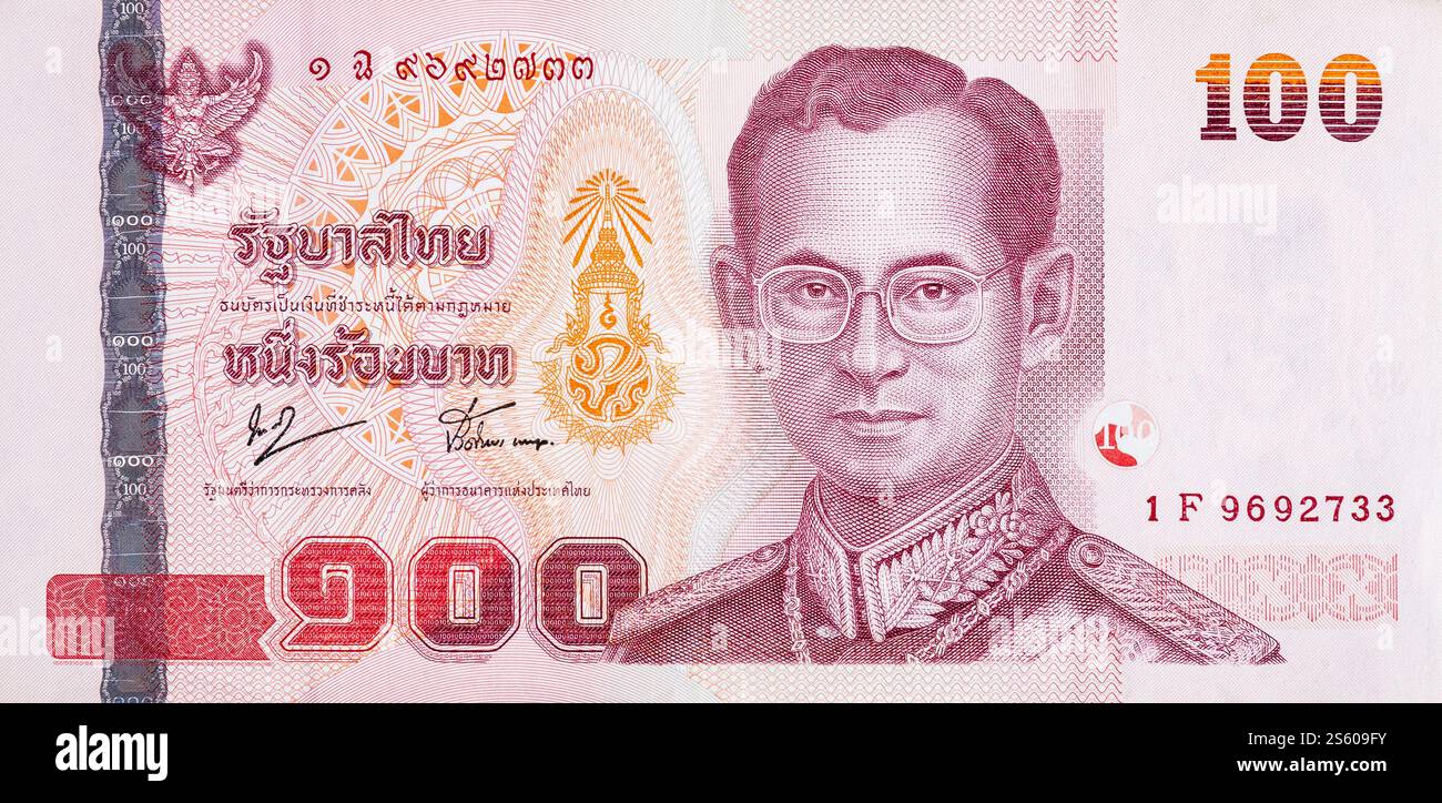 King Bhumibol Adulyadej on 100 Baht Thailand money bill close up. Bill ...