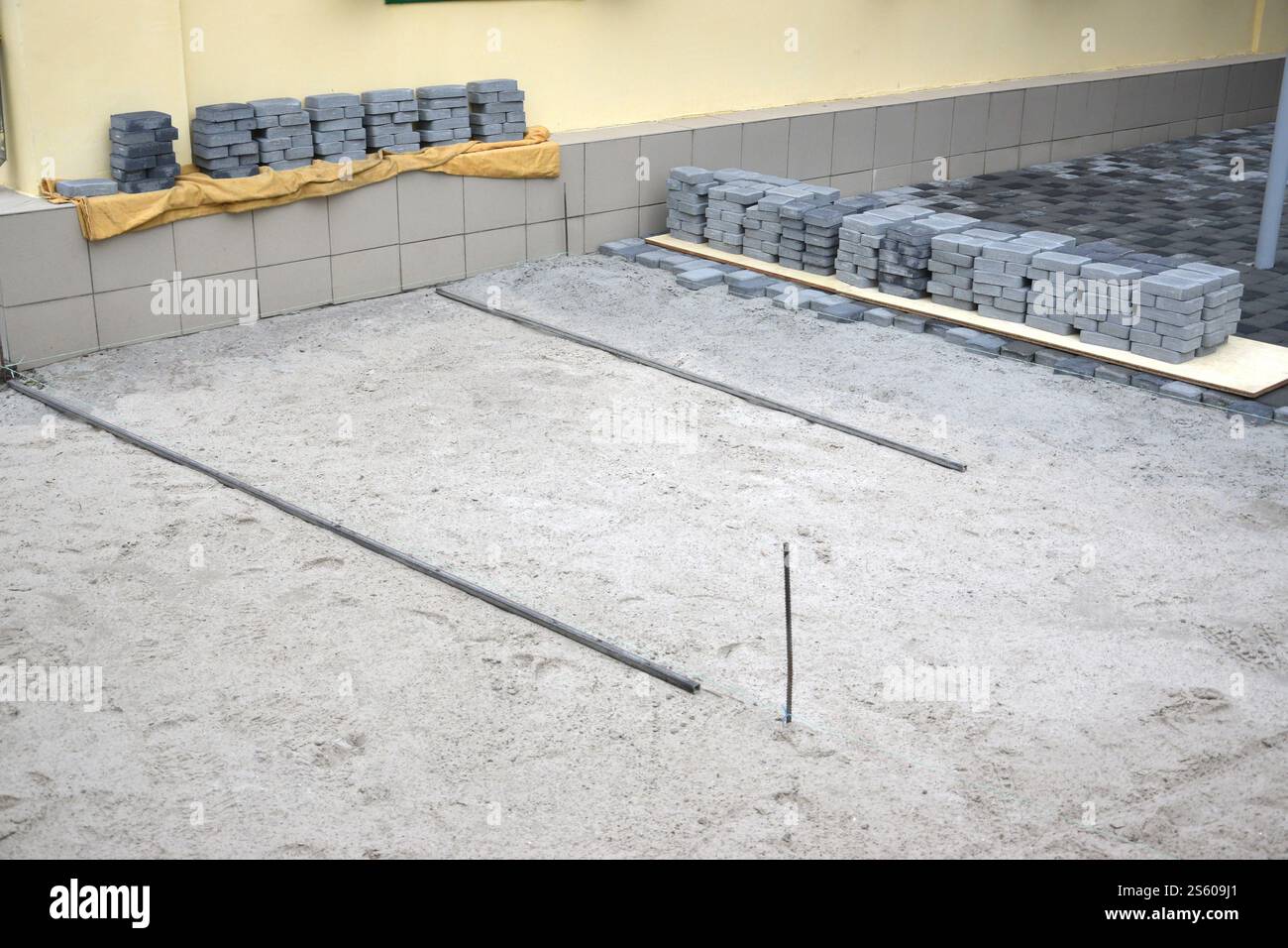 Rows of gray and dark grey walkway slab lying outdoors. Material for ...