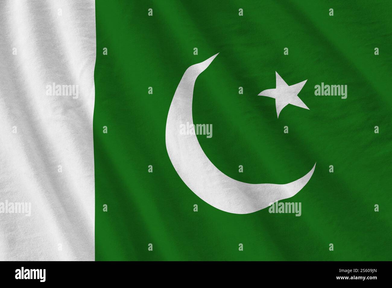 Pakistan flag with big folds waving close up under the studio light ...