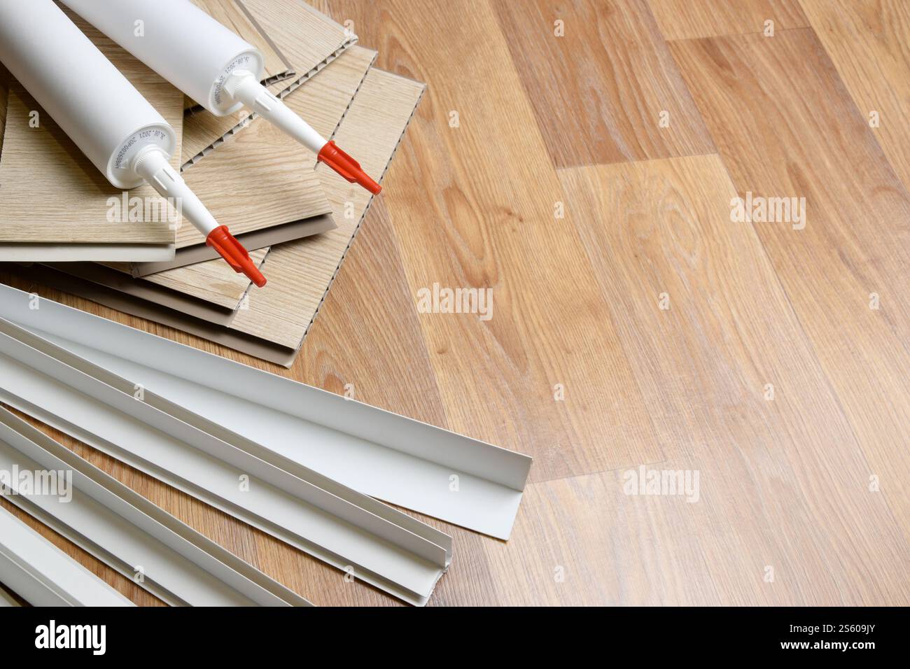 Set of items for PVC ceiling indoor works. Assembly adhesive bottles ...