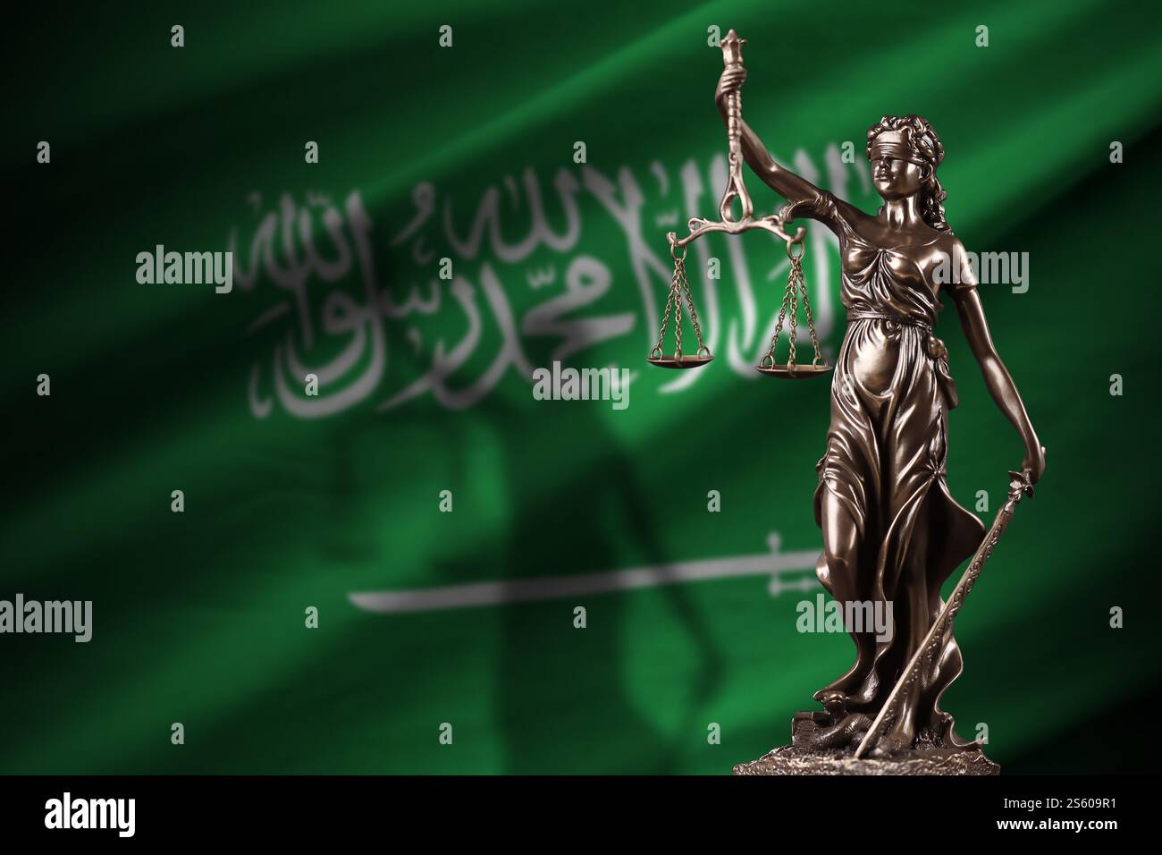Saudi Arabia flag with statue of lady justice and judicial scales in ...