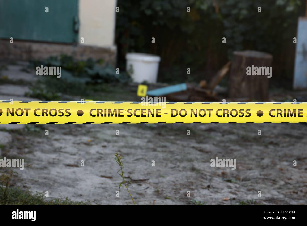 Crime scene tape for covering the area cordon. Yellow tape with blurred ...