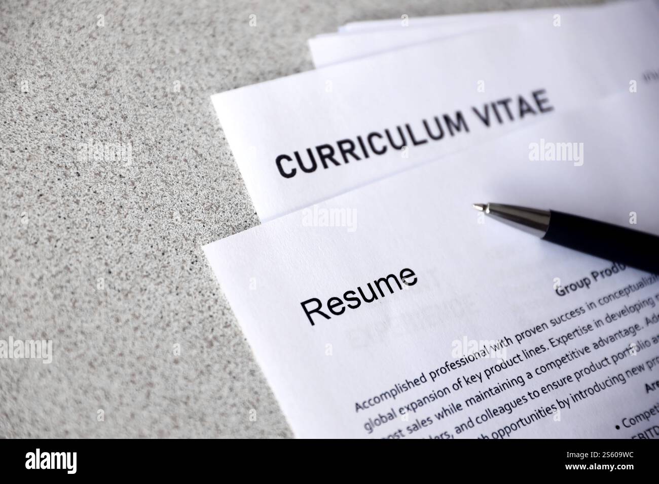 Top view of stack of office documents including resume and cv forms on ...